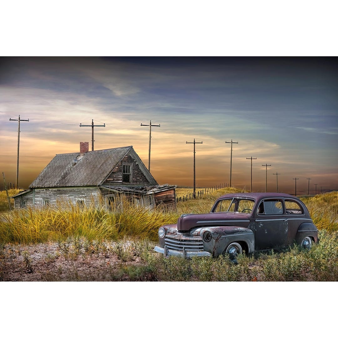 Abandoned Automobile by Row of Utility Poles With Abandoned Farm House ...