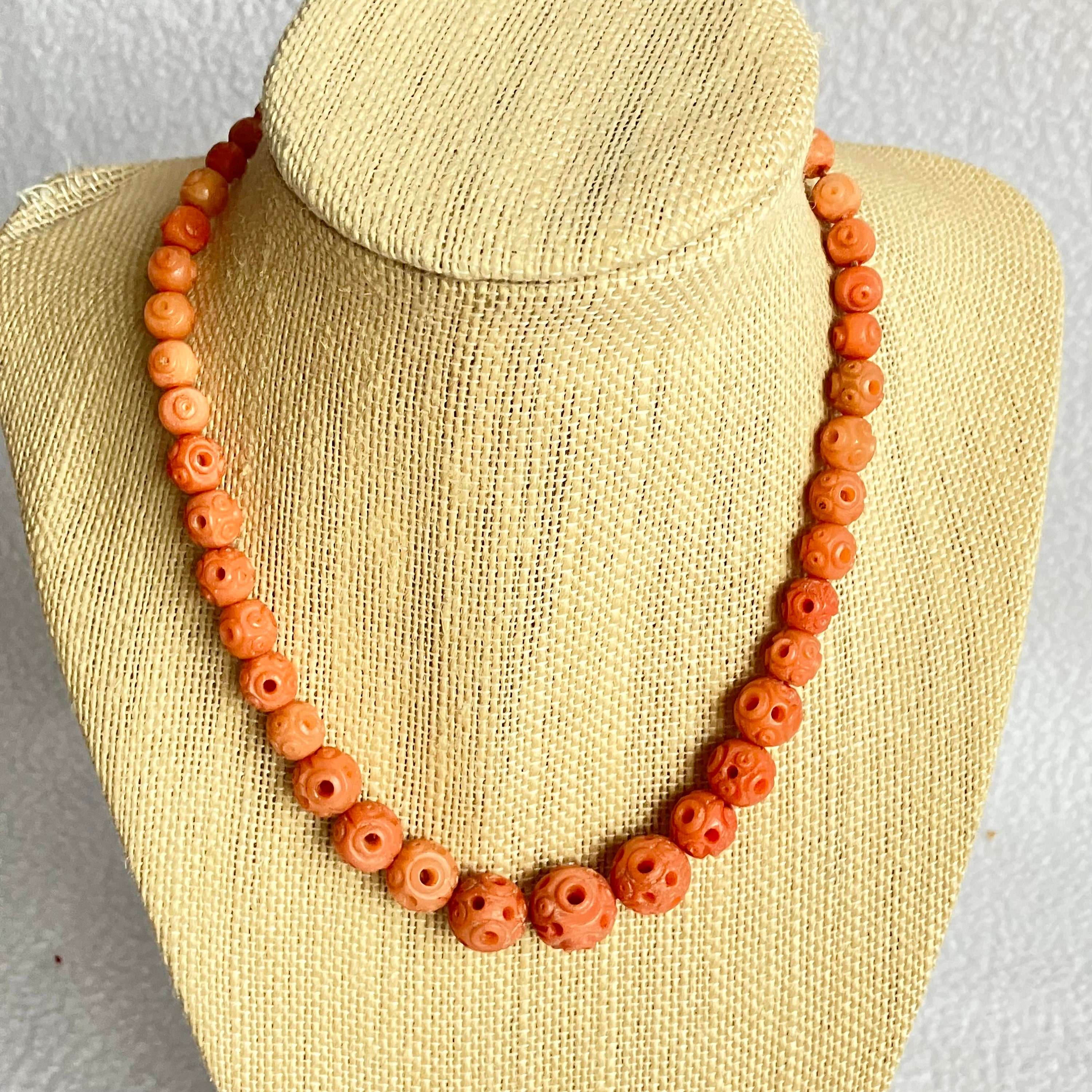 Carved coral bead necklace store