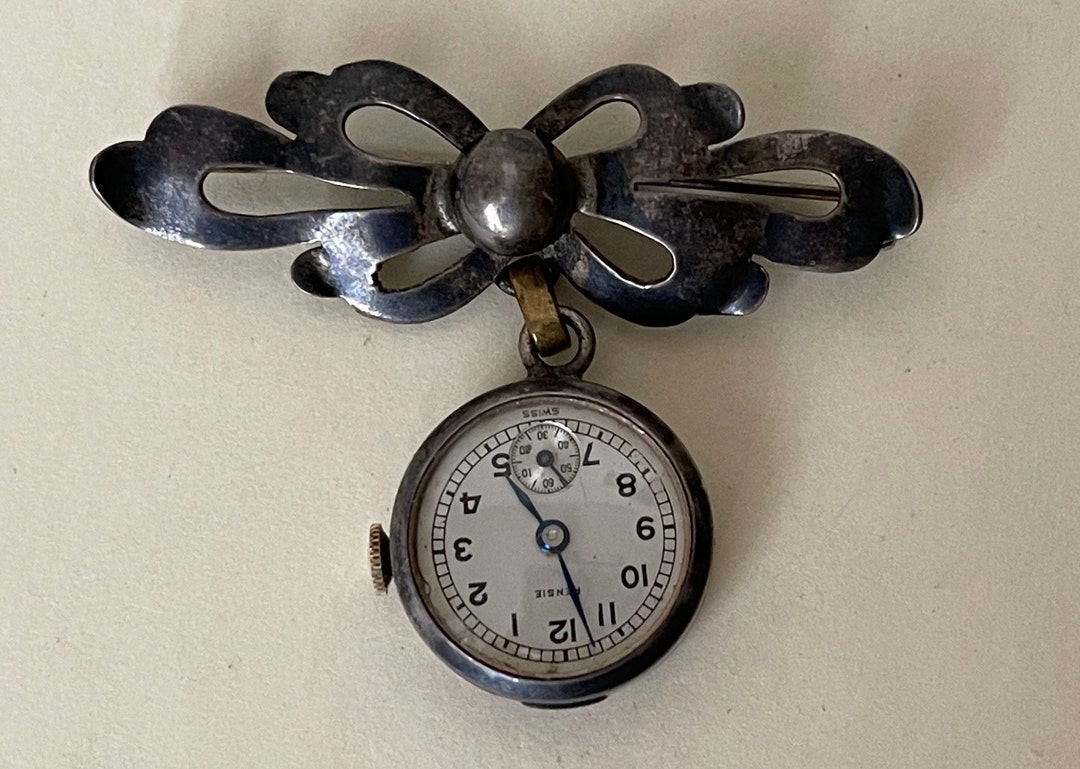 Rensie Winding Watch, Sterling Silver Bow Brooch. Watch-brooch. Runs ...
