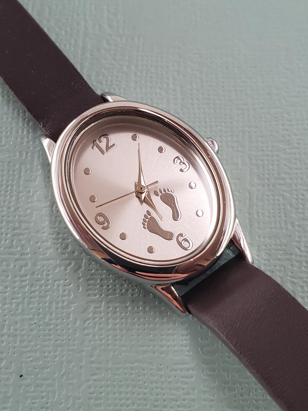 2000s Women's Quartz "footprints in the Sand" Silver Tone Watch With ...