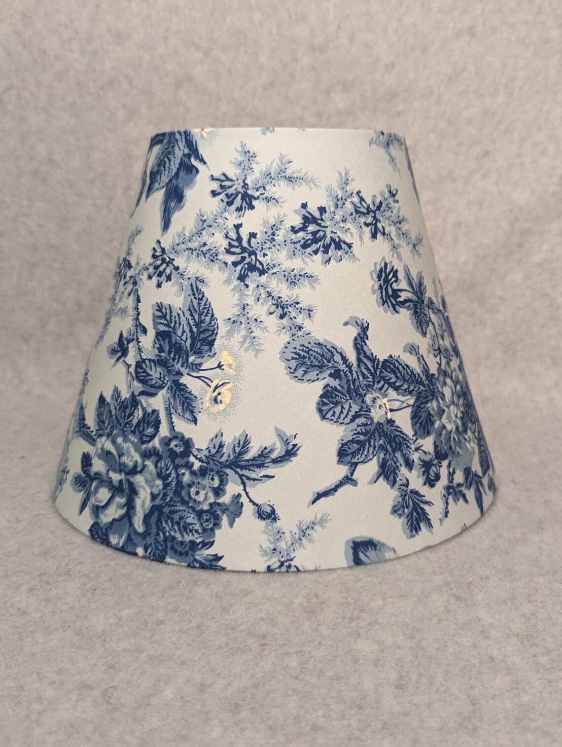 Vintage Look Blue Flowers Lamp Shade. Plants. Light Blue Background ...