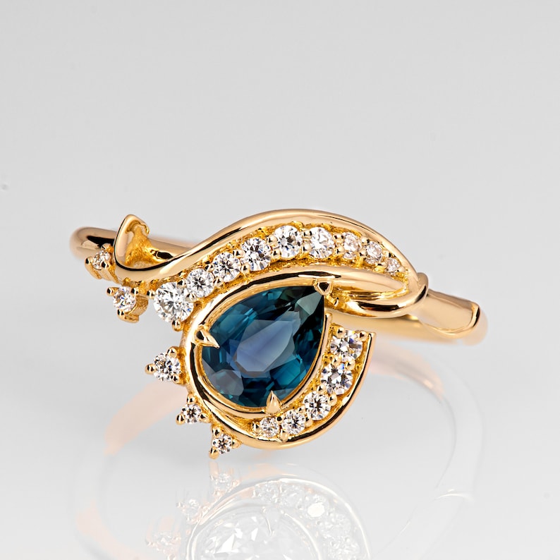 Anillo de compromiso Twisting Vines con halo y zafiro verde azulado en ...