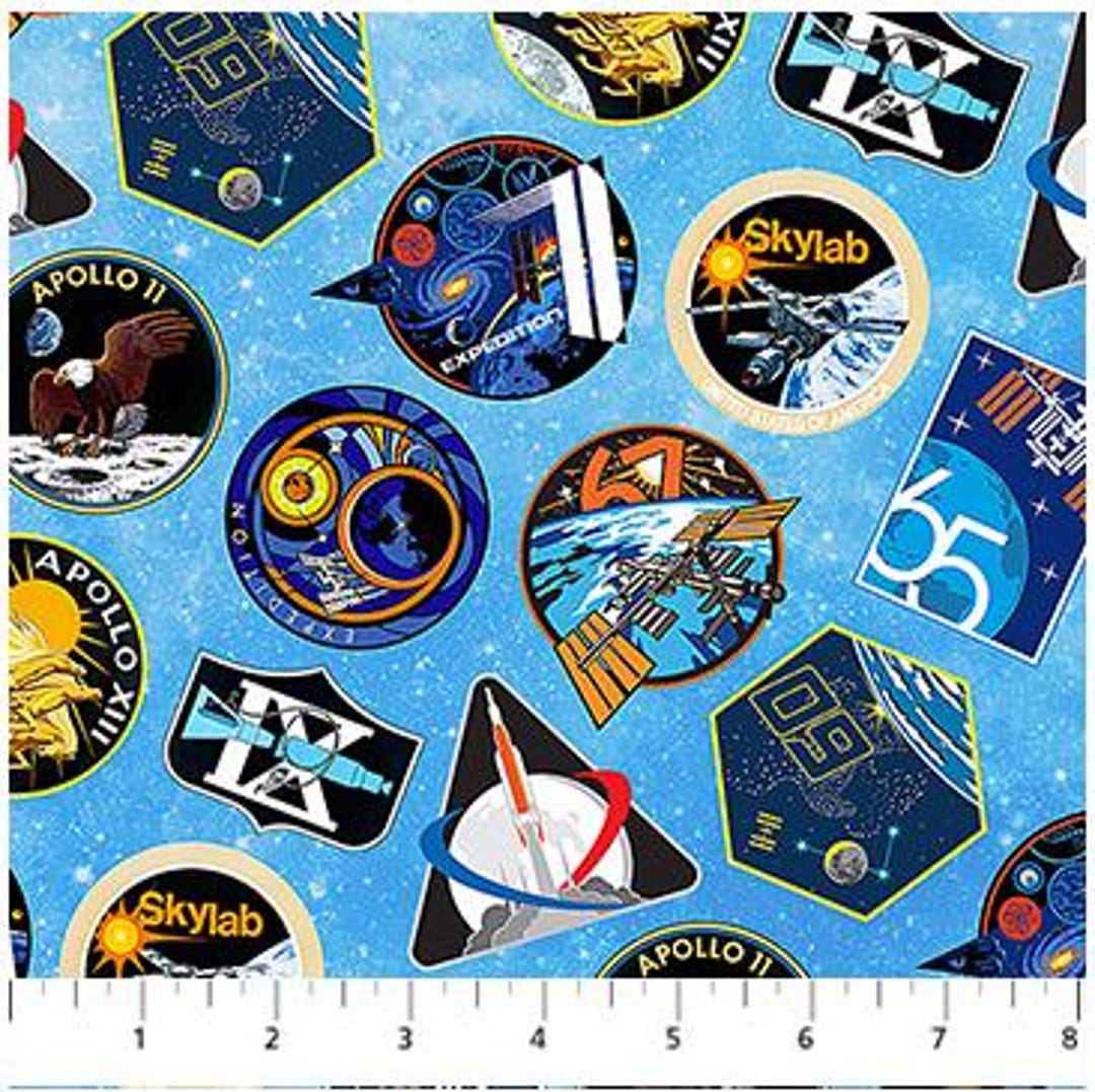 Space Odyssey NASA Symbols Fabric, Light Blue - Collection by Deborah ...