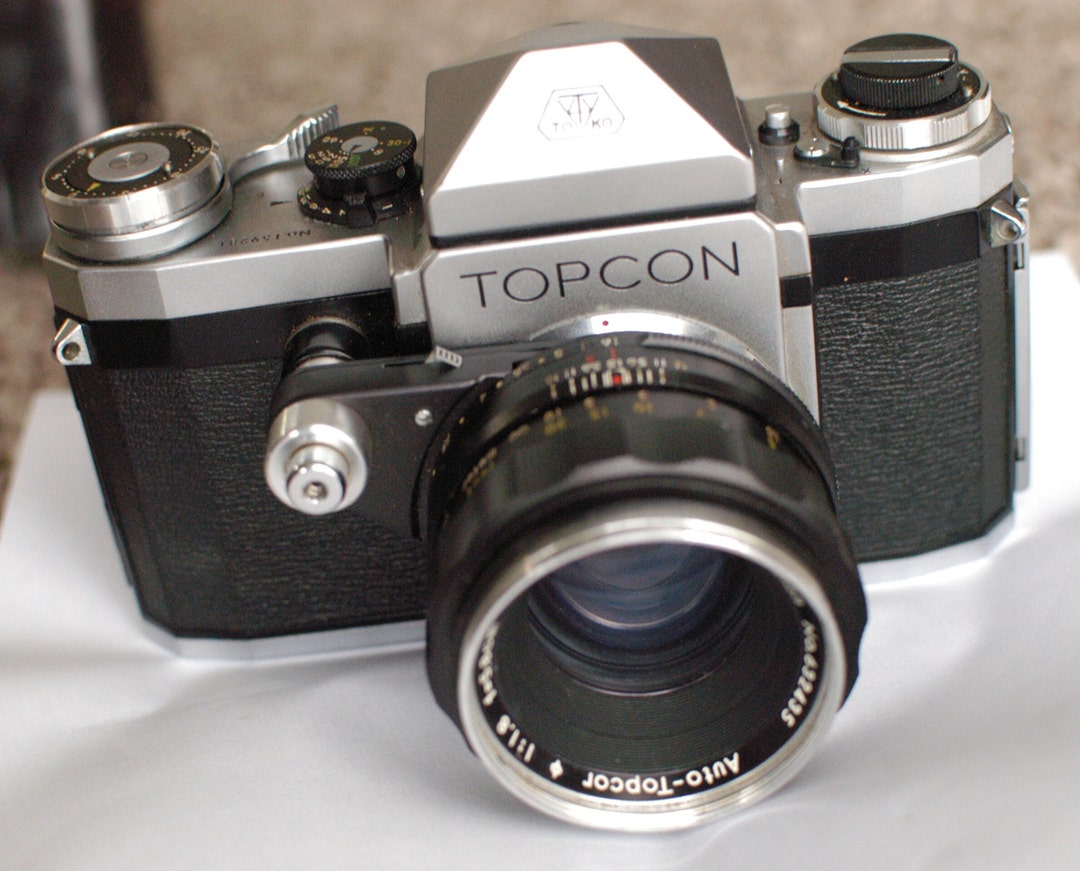 Topcon 35mm SLR Camera With 5.8cm F1.8 Lens Eveready Case and Offbrand ...