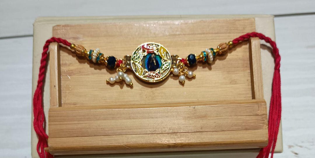 Handmade Swastik Rakhi: Red Thread, Wooden Beads - Raksha Bandhan - Etsy