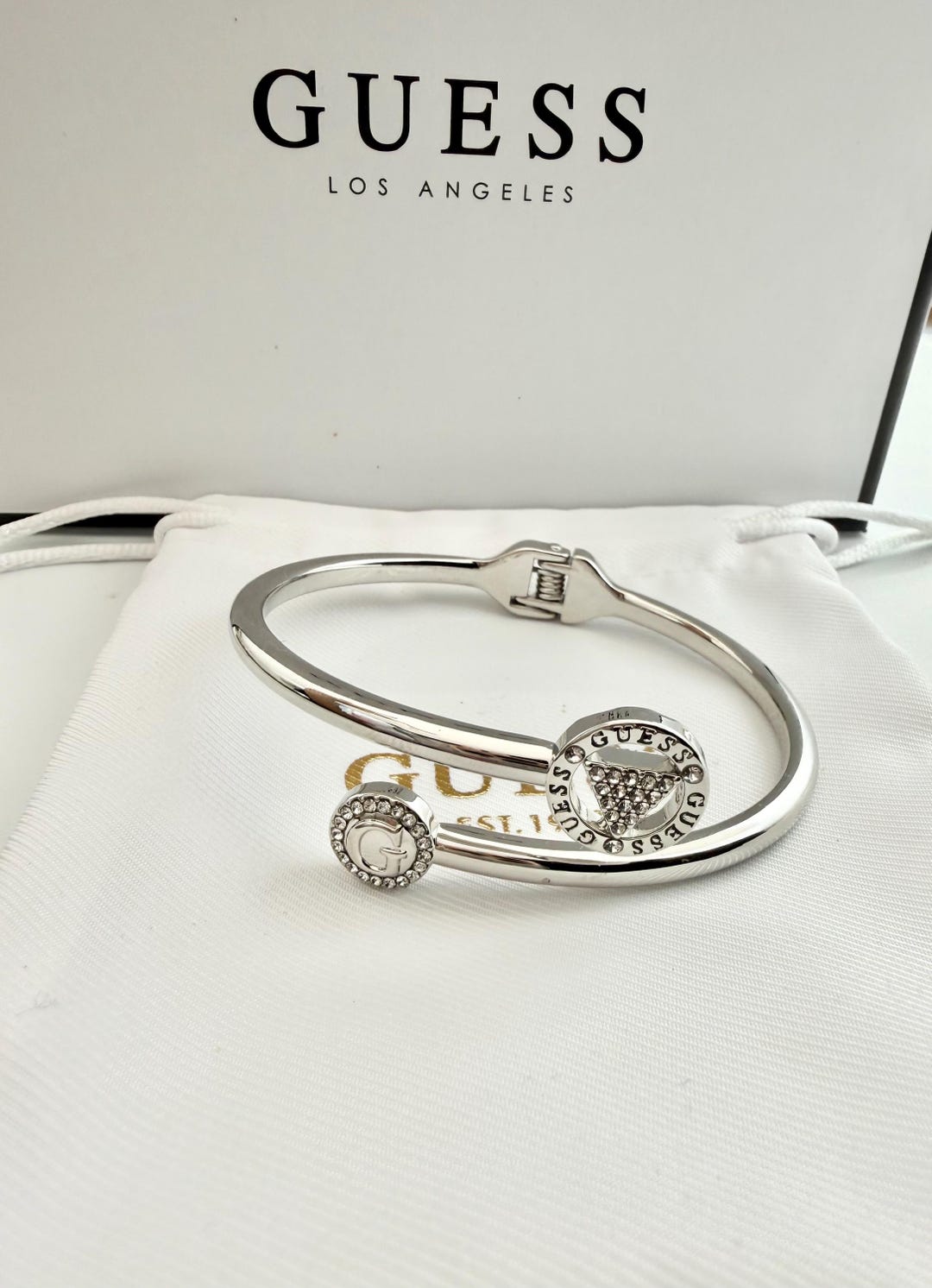 Guess Silver-tone Hinged Bangle | Crystal Triangle & G Logo Cuff ...