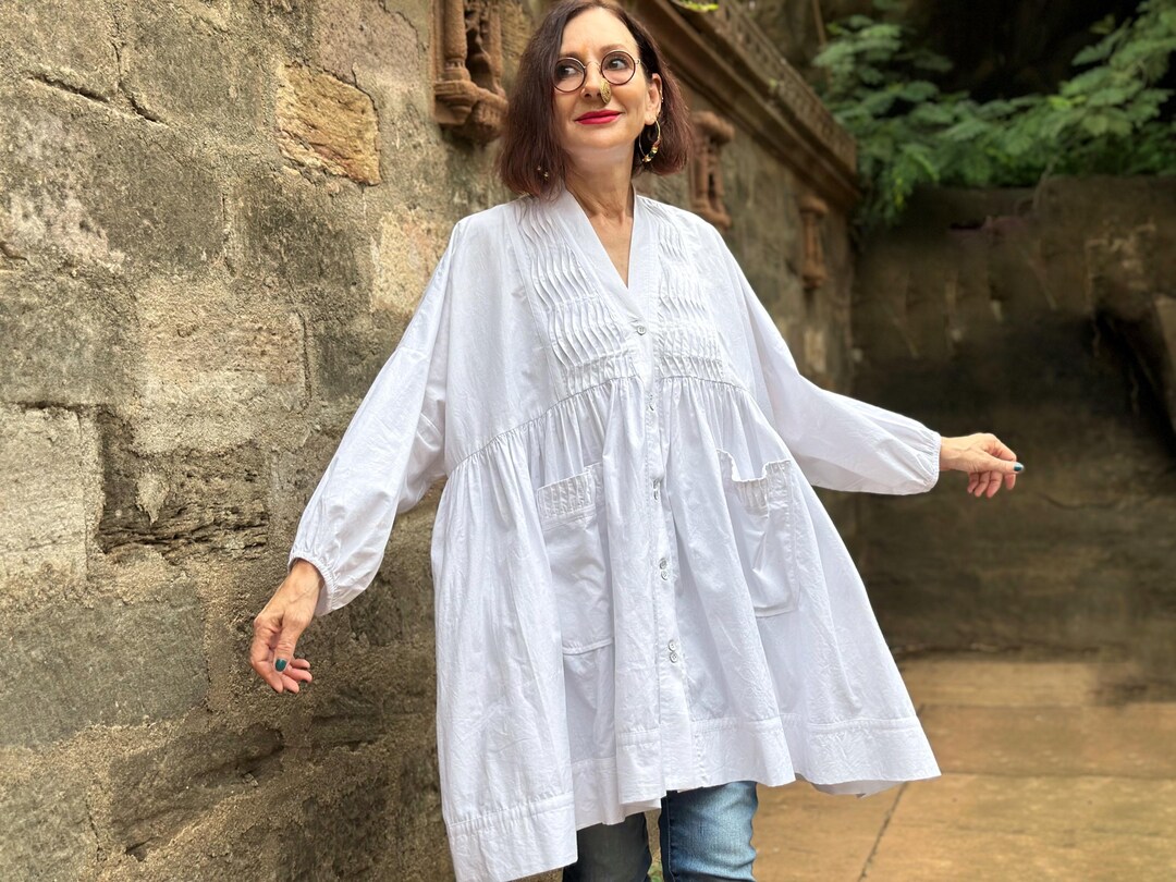 Loose Fitting White Cotton Shirt Has Bodice With Tucks. the Pockets ...