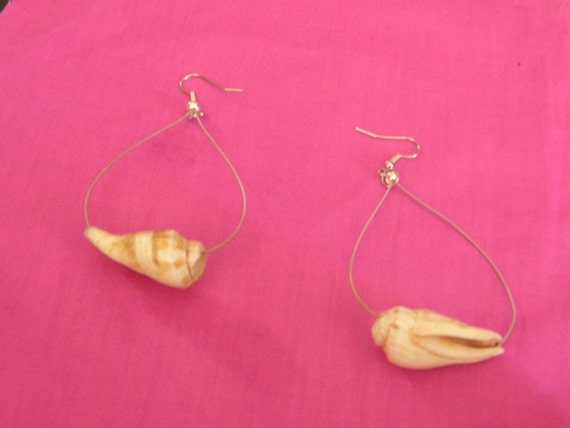 Items similar to guitar string conch shell hoop earrings on Etsy
