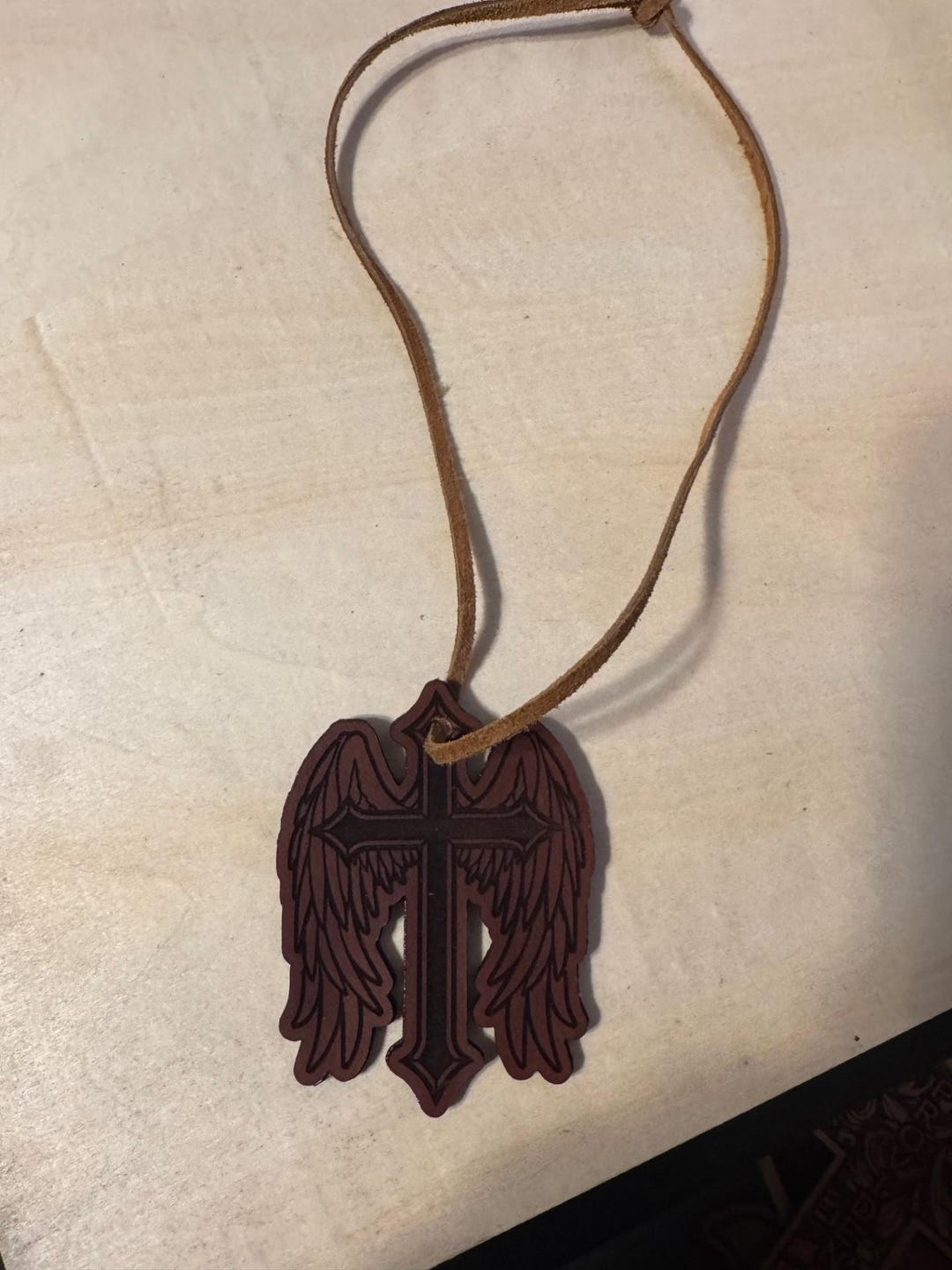 Laser Engraved Cross With Wings Design on Genuine Leather. Rearview ...
