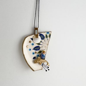 Quirky Found Object Mixed Media Collage Folk Art. Nesting Doll Riding a ...