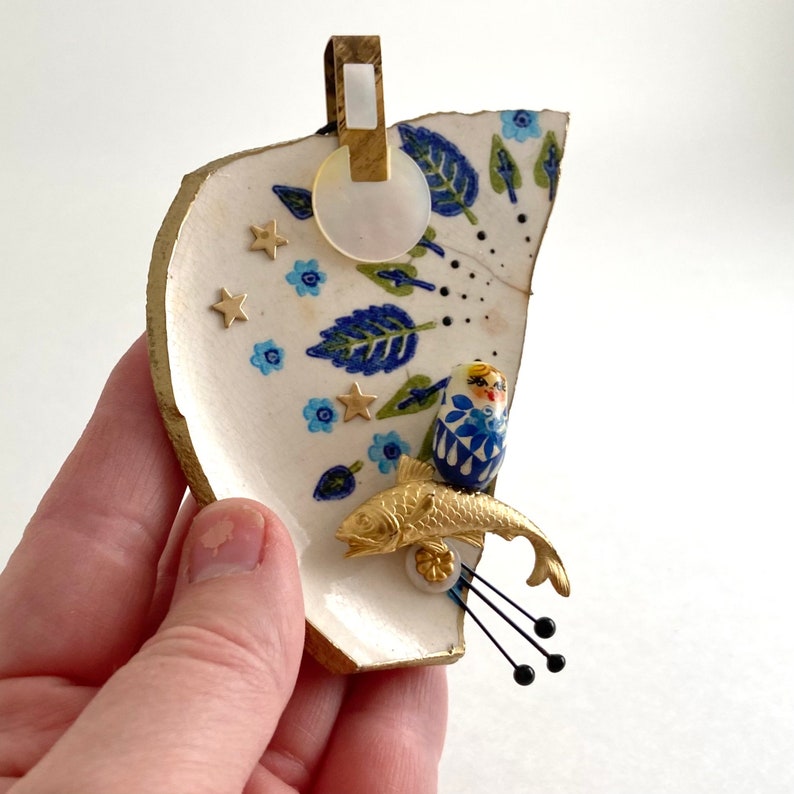 Quirky Found Object Mixed Media Collage Folk Art. Nesting Doll Riding a ...