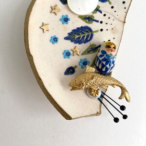 Quirky Found Object Mixed Media Collage Folk Art. Nesting Doll Riding a ...