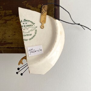 Quirky Found Object Mixed Media Collage Folk Art. Nesting Doll Riding a ...