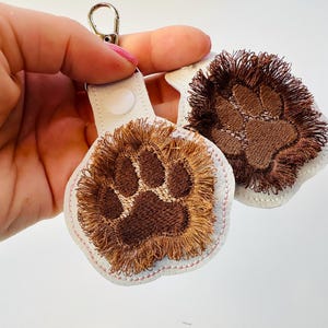 Fringed Dog Puppy Paw Eyelet and Key Fob Snap Tab in the Hoop Machine ...