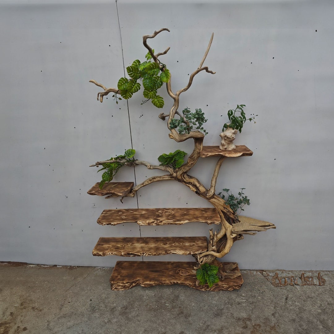 A Solid Wood Live Edge Floating Shelf With a Tree Branch Standing as a ...