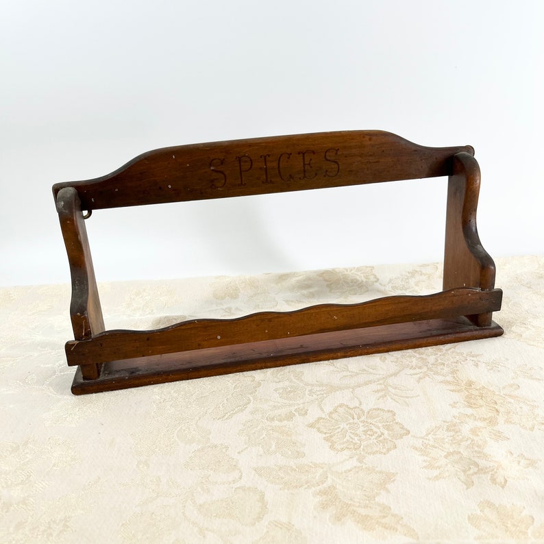 Wooden Spice Rack With Bold Writing Carved Fence Holding the Jars in ...