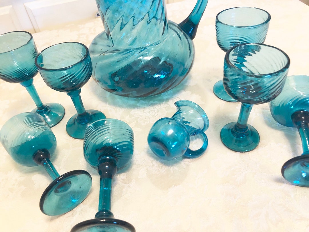 9 Handblown Turquoise Glass Pitcher and Glasses. 7 Goblet Glasses With ...