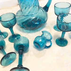 9 Handblown Turquoise Glass Pitcher and Glasses. 7 Goblet Glasses With ...