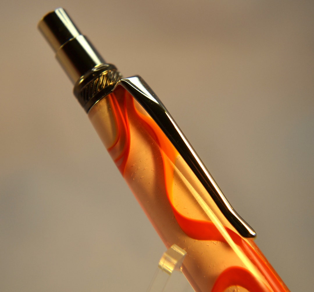 It's a fire Glass Transparent Acrylic Pen With Gun Metal and Nickel ...