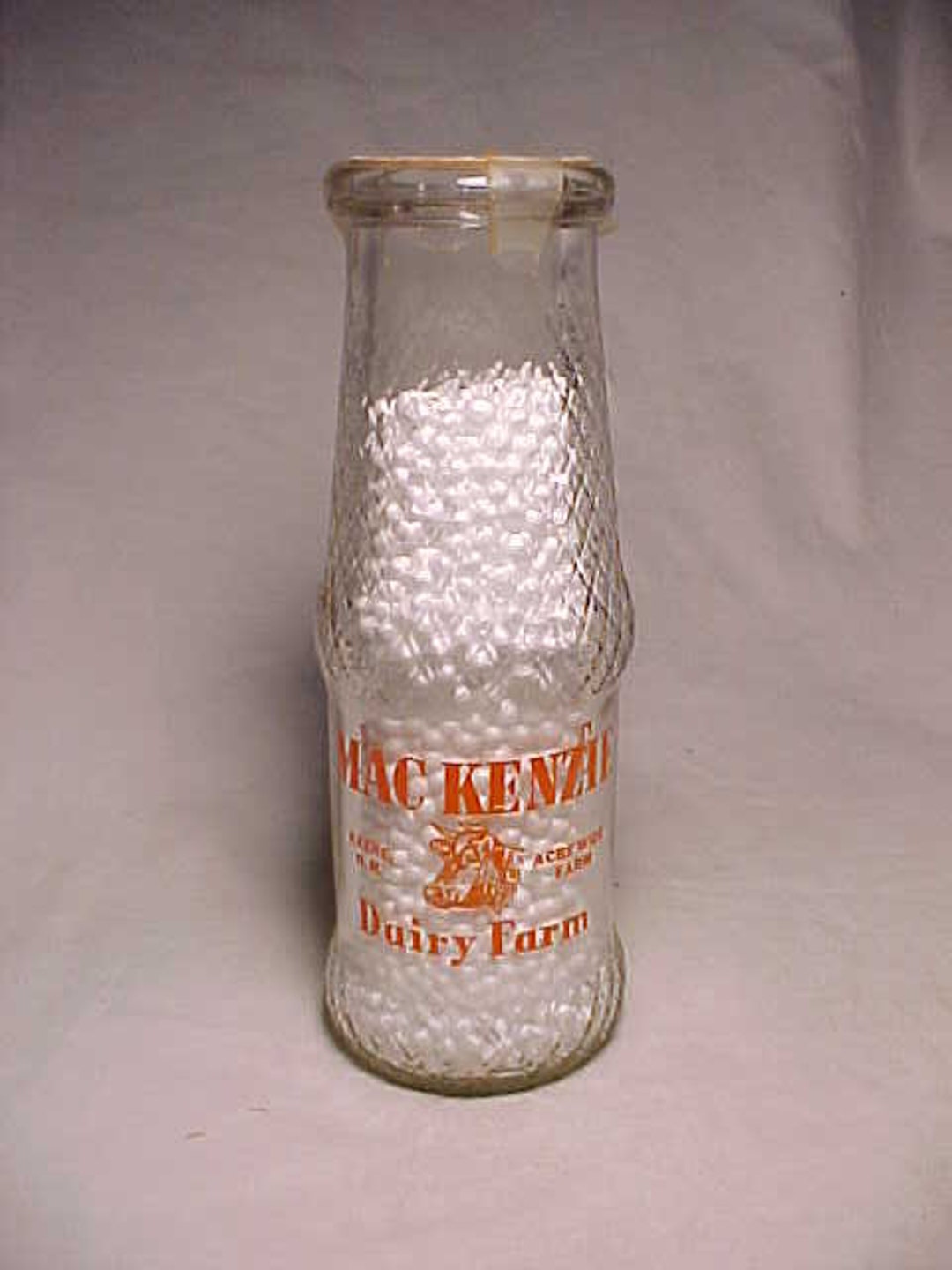 1958 Mac Kenzie Keene, N.H., Half Pint Size Orange Pyro Painted Label ...