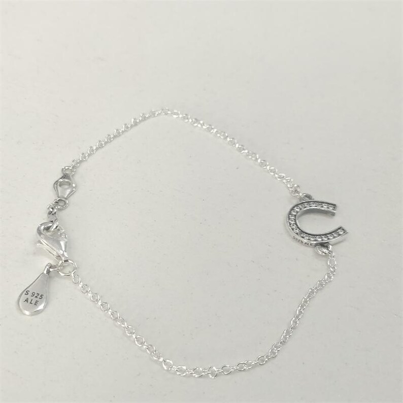 Pulsera Pandora de plata con símbolo de la suerte, herradura y ...