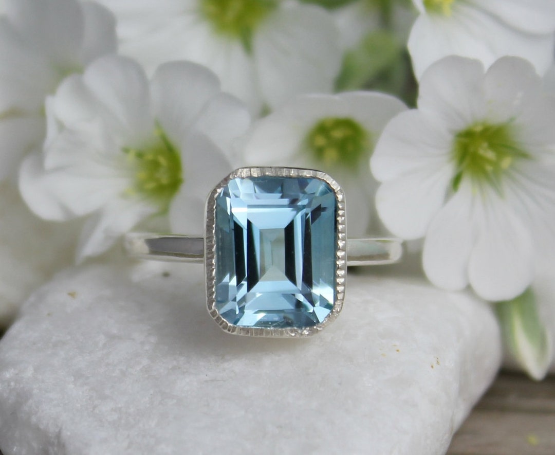 Emerald Cut Sky Blue Topaz Ring - Sterling Silver Textured Halo Bezel ...
