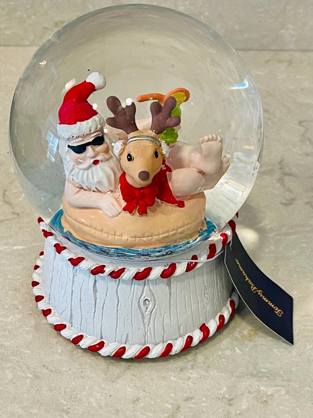 Musical Christmas Snow Globe Features Santa on the Beach With Reindeer ...