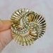 Vintage 1960s Pinwheel Brooch in Gold Tone Metal With Rhinestones by ...