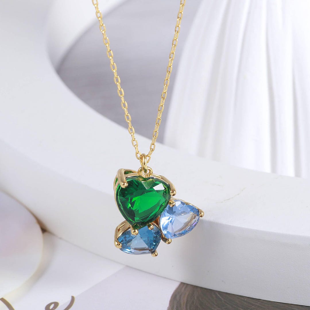 Gold-toned Necklace Featuring a Green Heart-shaped Crystal With Smaller ...