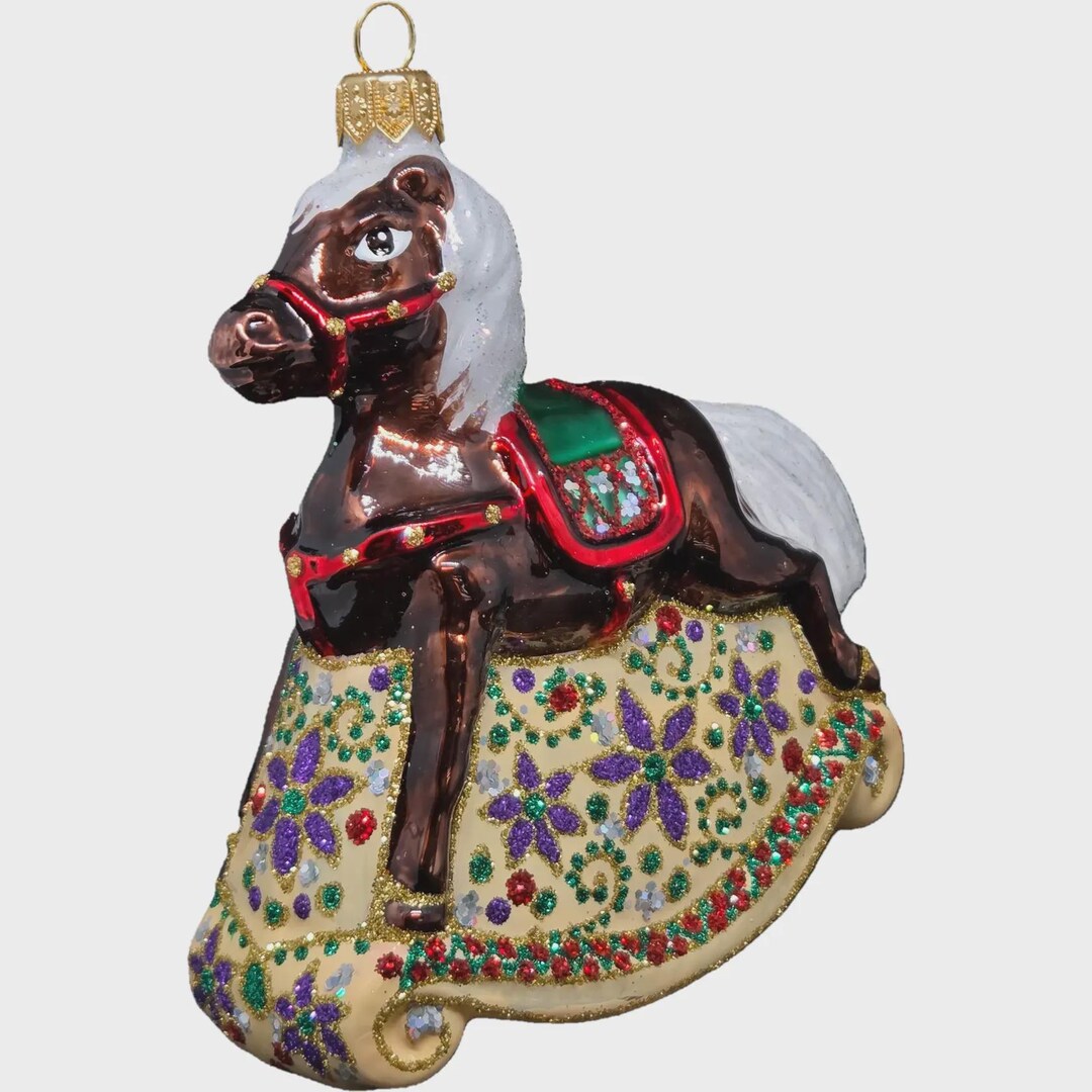 A Glass Bauble in the Shape of a Brown Rocking Horse, Decorated With an ...