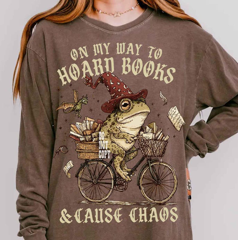 Funny Hoard Books Cause Chaos Png, Frog on Bike Witch Hat Png, Frog ...