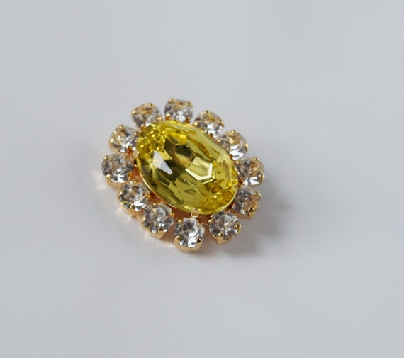 Yellow brooch store