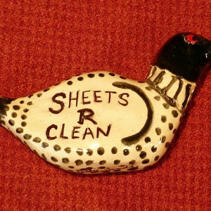SHEETS R CLEAN Loon Sits on Your Guest Bedroom Bed to Remind You That ...