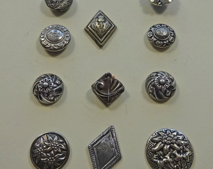 Collection of 11 antique/vintage small silver coloured buttons, mostly ...