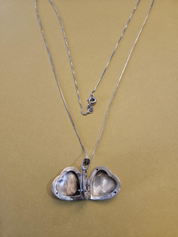Unusual heart locket that turns into a four leaf clov… - Gem
