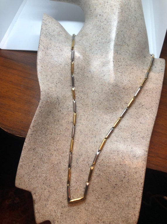 stainless steel and gold - Gem