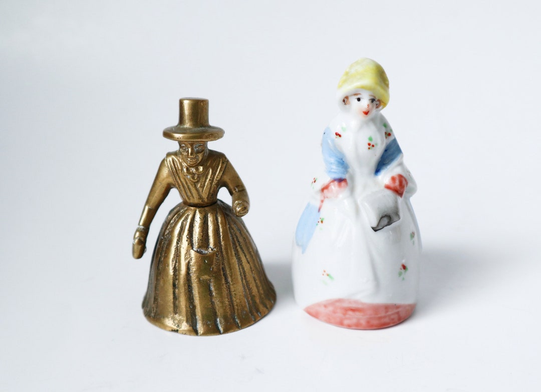 2 Vintage Small Bells Brass Welsh Lady Porcelain Colonial Lady Figural ...