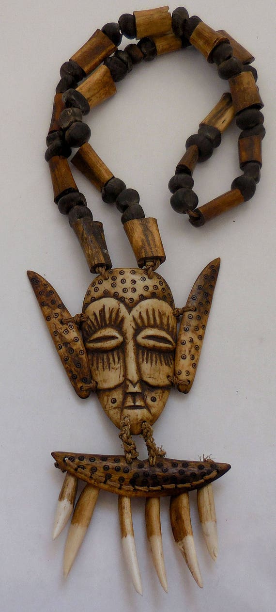 african inspired carved bone - Gem