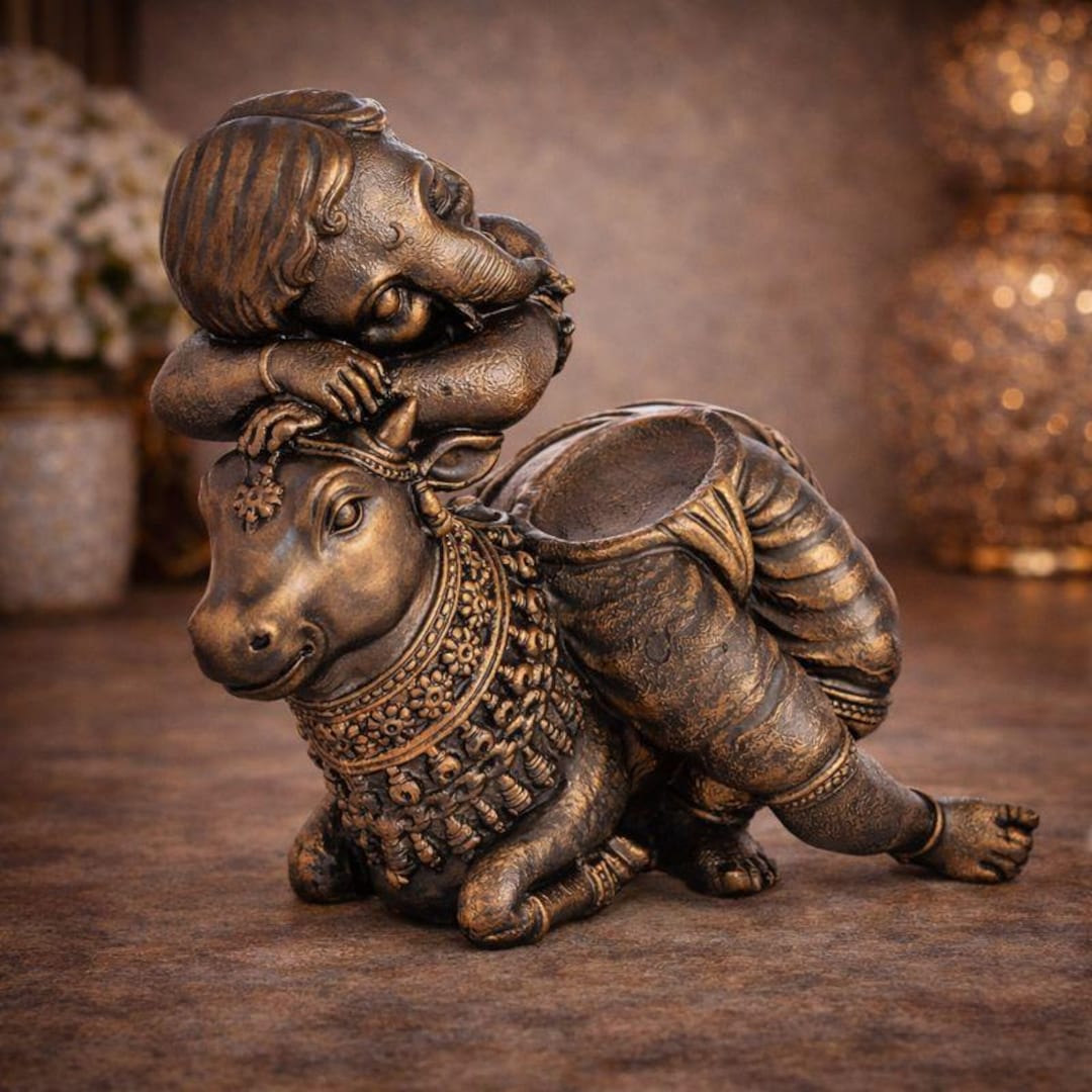 Sleeping Baby Ganesha Statue on Cow | Antique Brass Finish Resin ...
