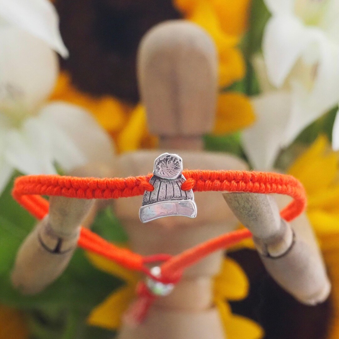 A Cosy Tiny Handmade Fine Silver Bobble Hat on a Gorgeous Bright ...