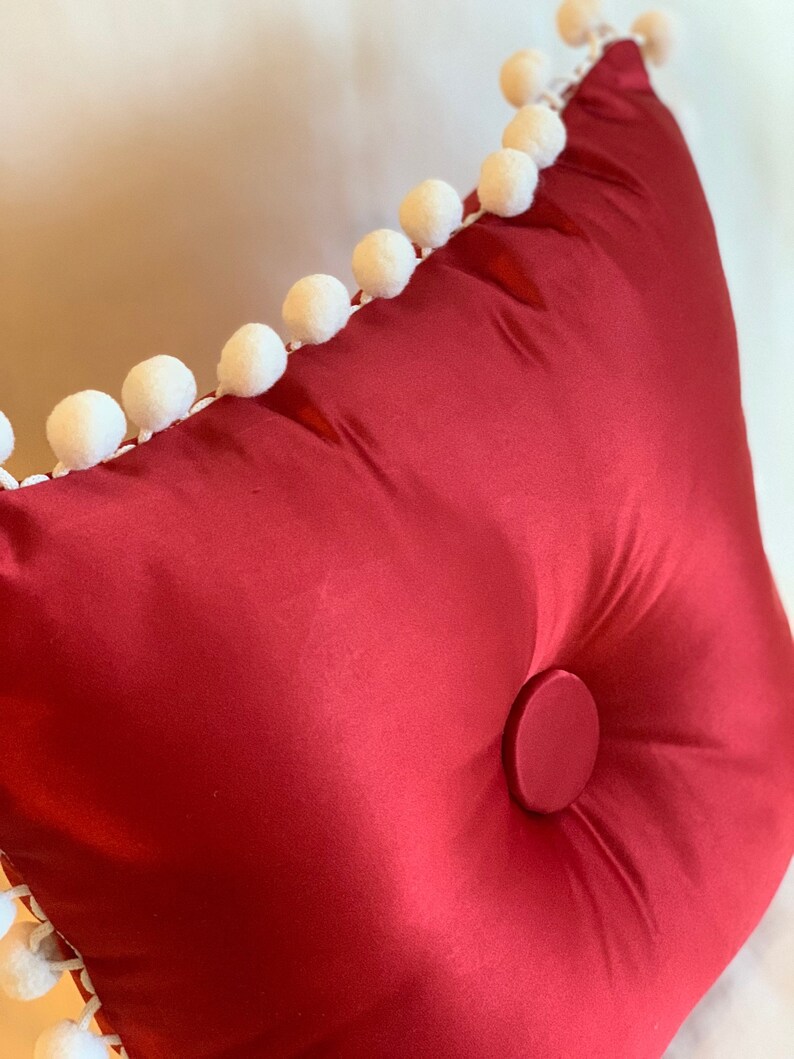 Natural Red Silk Pillow With White Fuzzy Pom Pom's and A Center Button ...