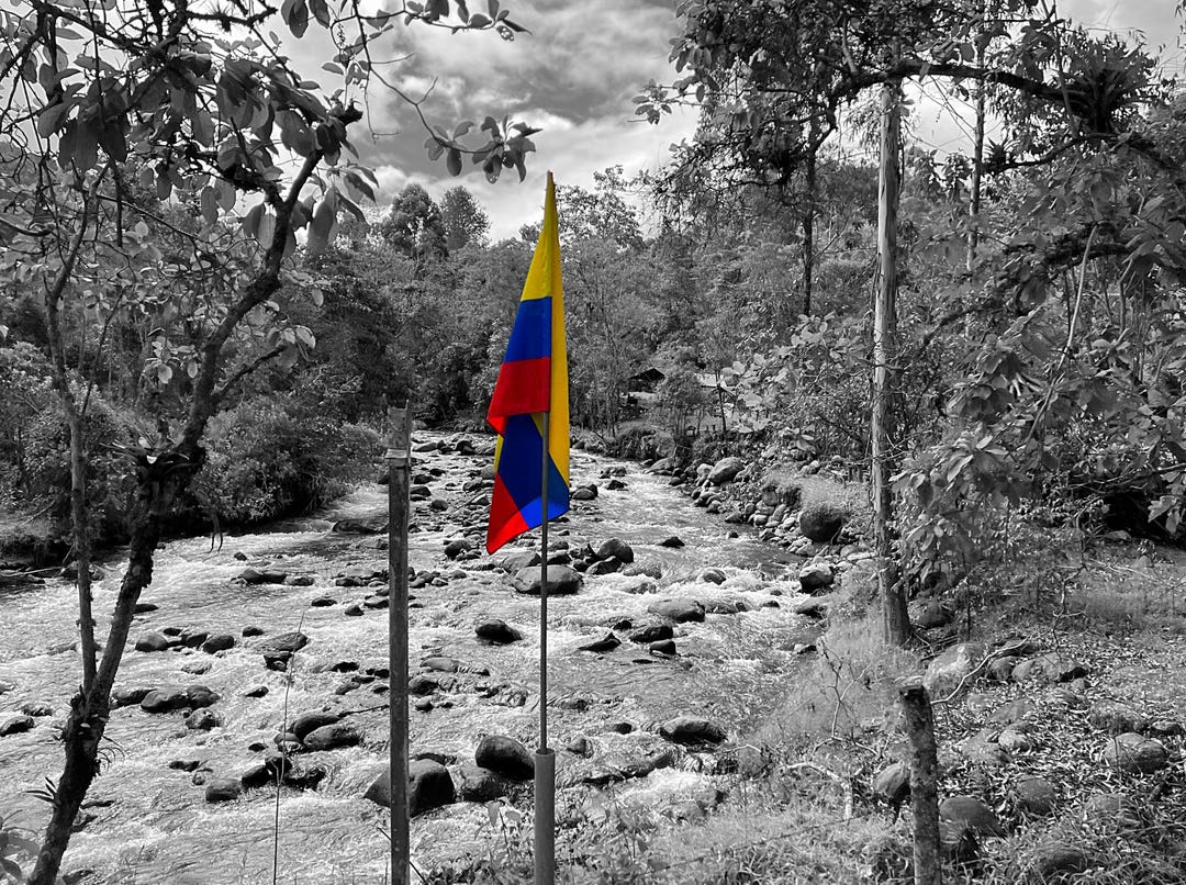 Colombia, Salento — Valle De Cocora River View With Flag Selective ...