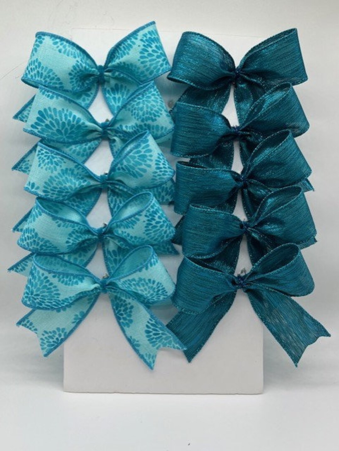 Decorative Bows in Ice Blue With Turquoise Color Burst on Royal Burlap ...