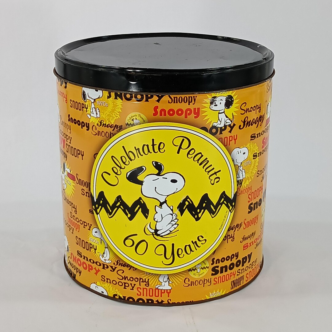 Tin Peanuts® Snoopy™ "celebrate Peanuts 60 Years" Charles Schulz ...