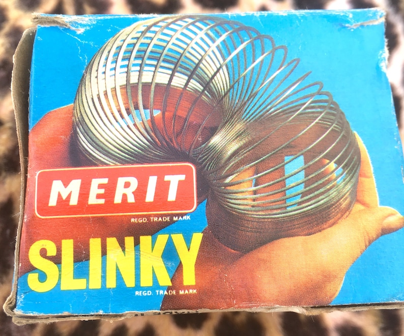 Merit 1960s Walking Spring METAL SLINKY TOY Walks Down Stairs | Etsy