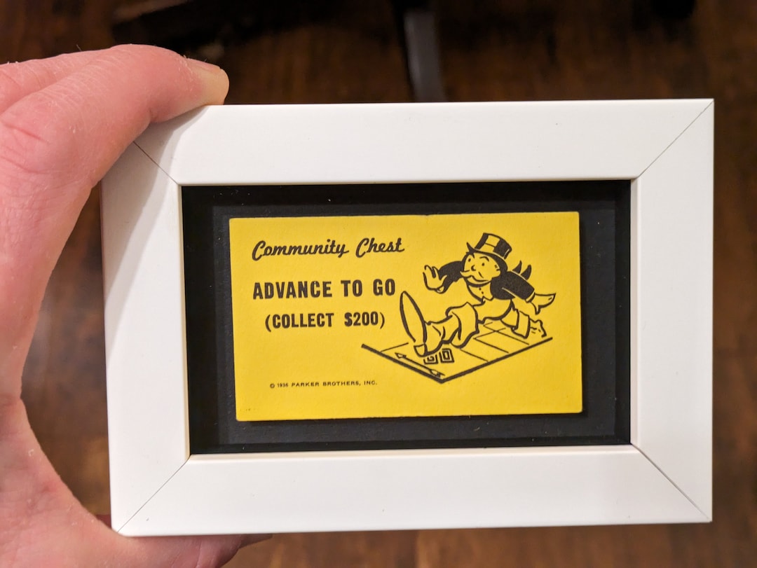 Advance to GO! Collect 200 Dollars! Monopoly® Community Chest Card in a ...