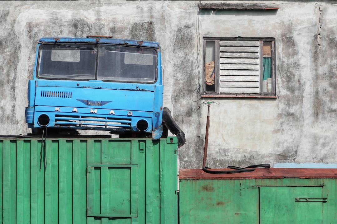 Old Kamaz Truck Cabin Sitting on a Green Container With White Decay ...