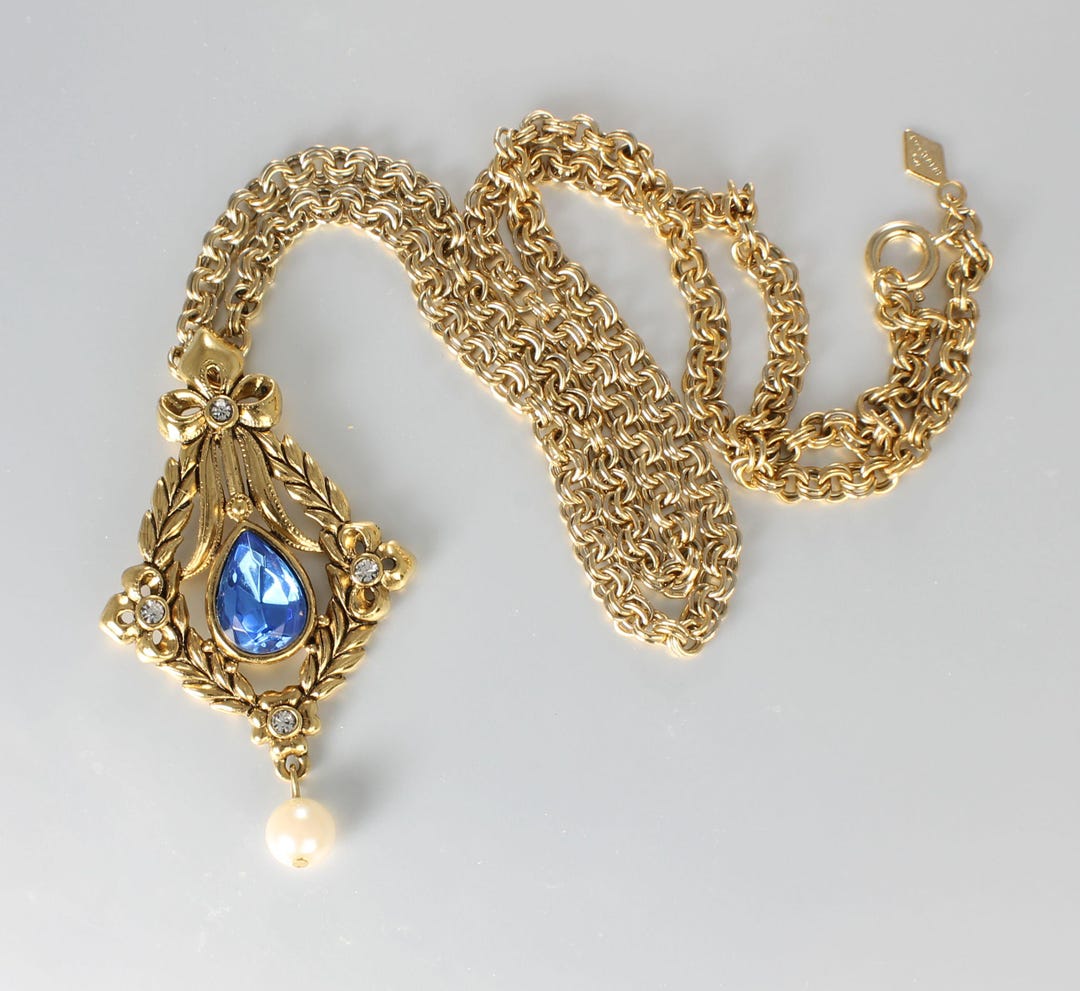 AVON Bold Traditions Blue Rhinestone Bow Pendant Necklace, Gold Tone ...