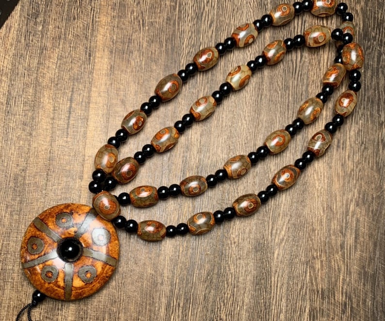 Tibetaner von drei Augen bis zehn-äugige Dzi Perlen-Halskette ...