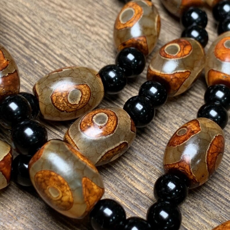 Tibetaner von drei Augen bis zehn-äugige Dzi Perlen-Halskette ...